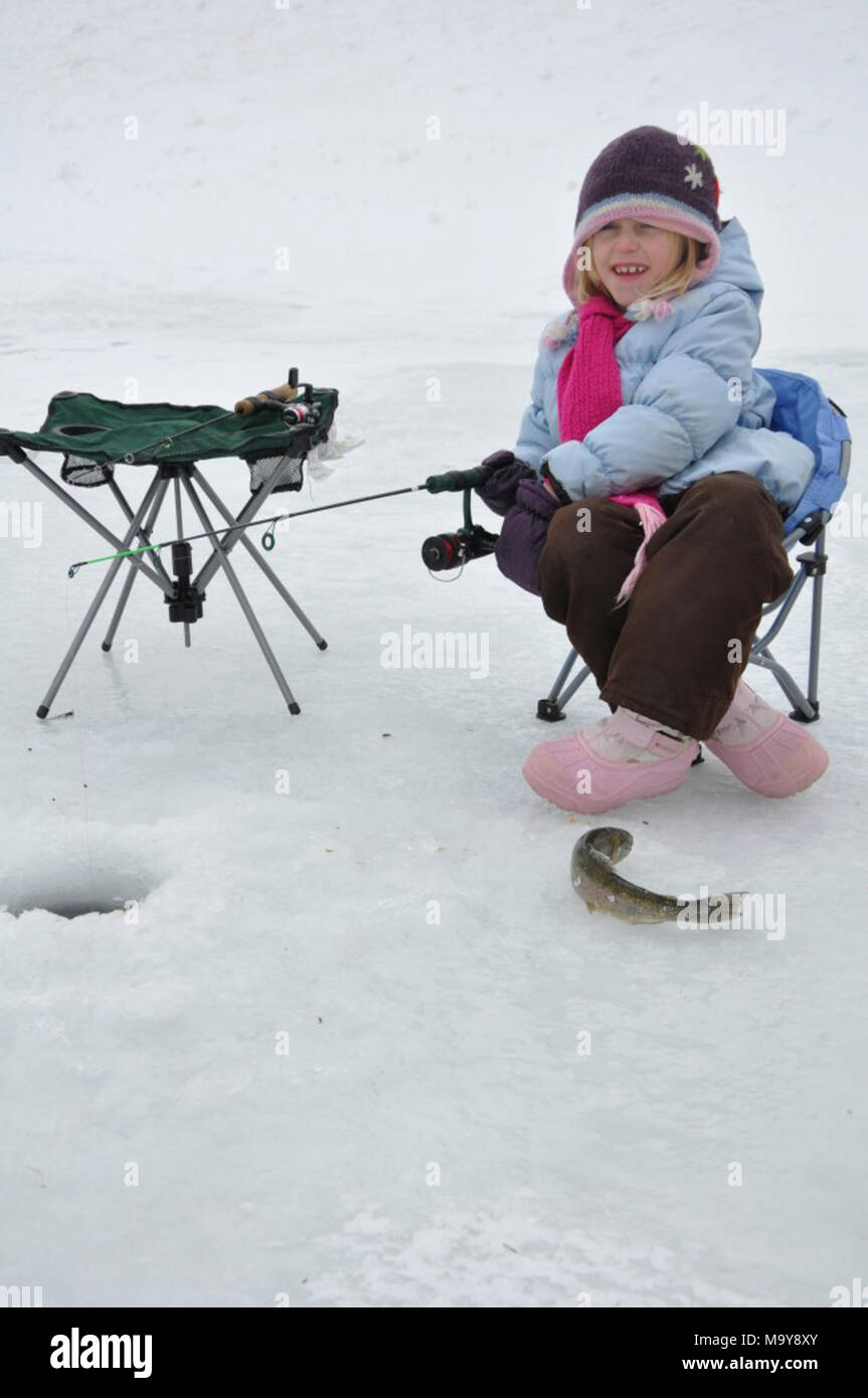 Kids ice fishing competition Stock Photo - Alamy