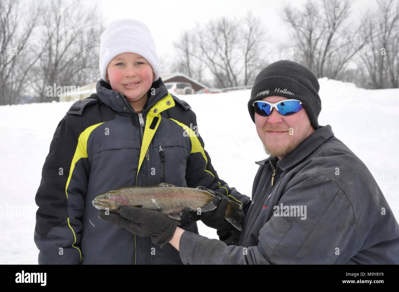 Kids ice fishing competition Stock Photo - Alamy