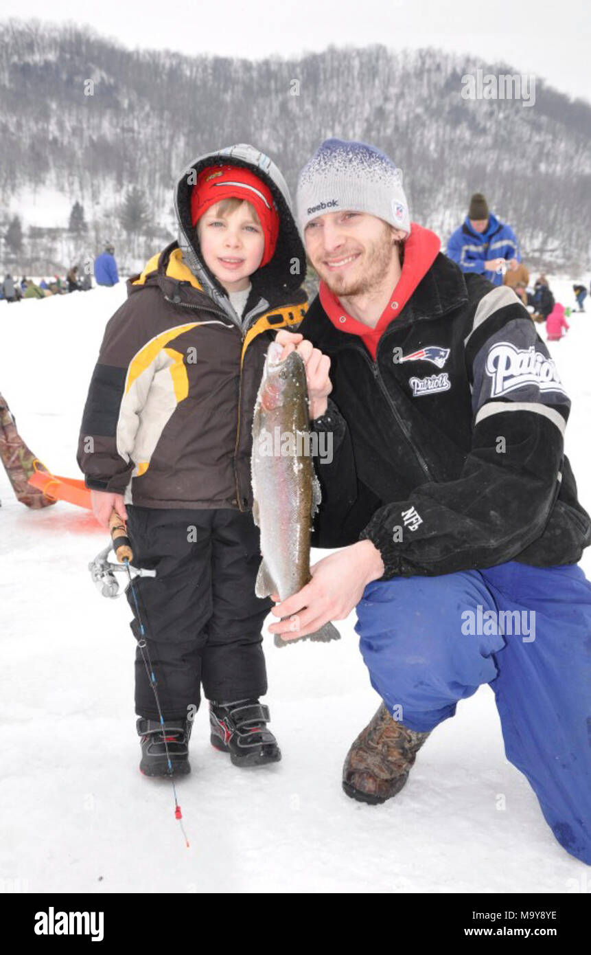 Kids ice fishing competition Stock Photo - Alamy