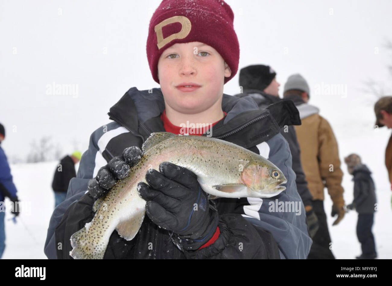Kids ice fishing competition Stock Photo - Alamy