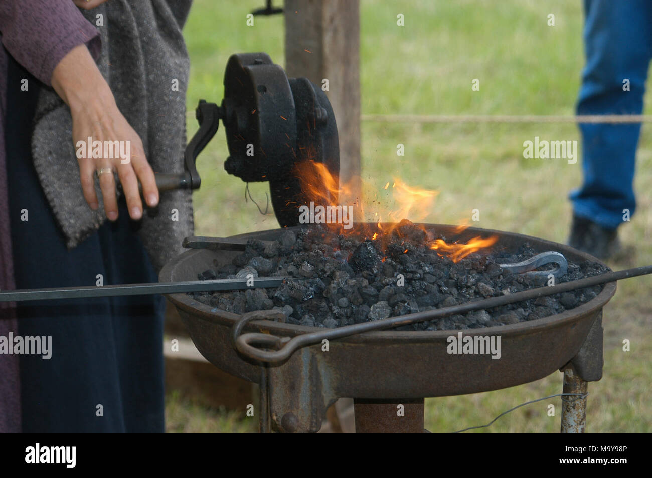 feeding the fire Stock Photo - Alamy