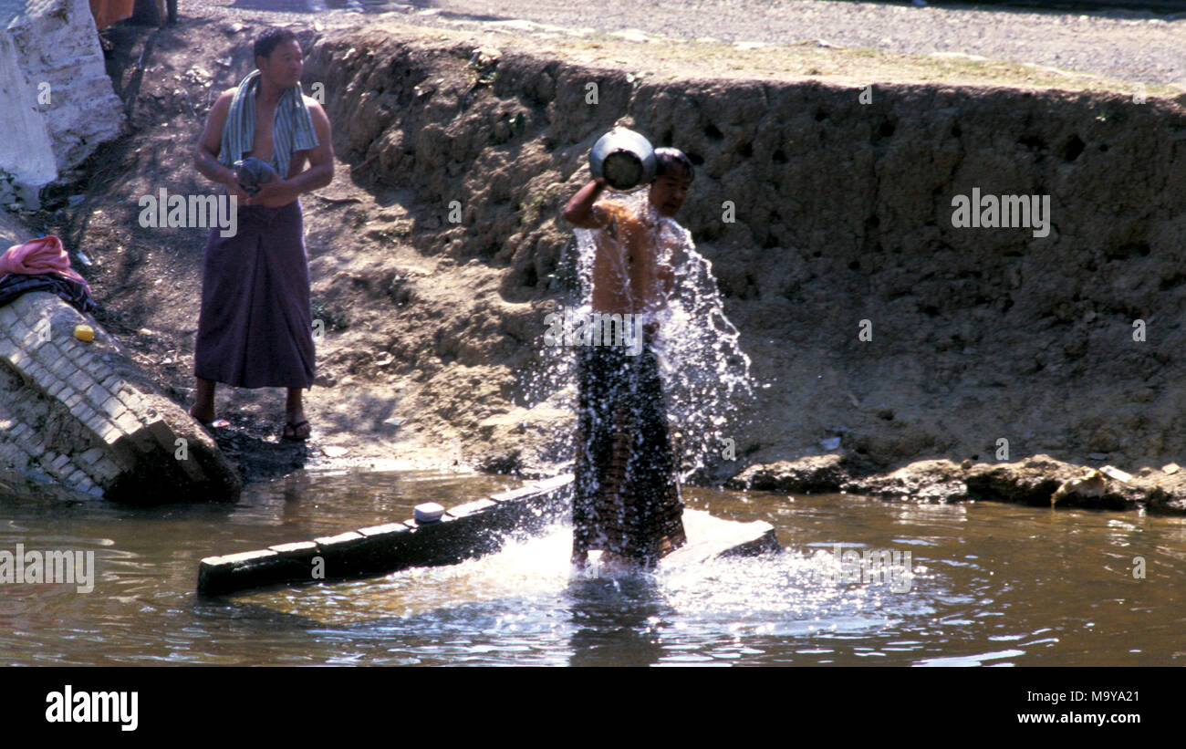 Indigenous Shan men washing themselves in their village river. Shan ...