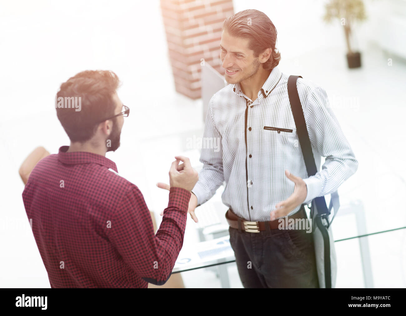 professionals speak, standing in the office Stock Photo - Alamy