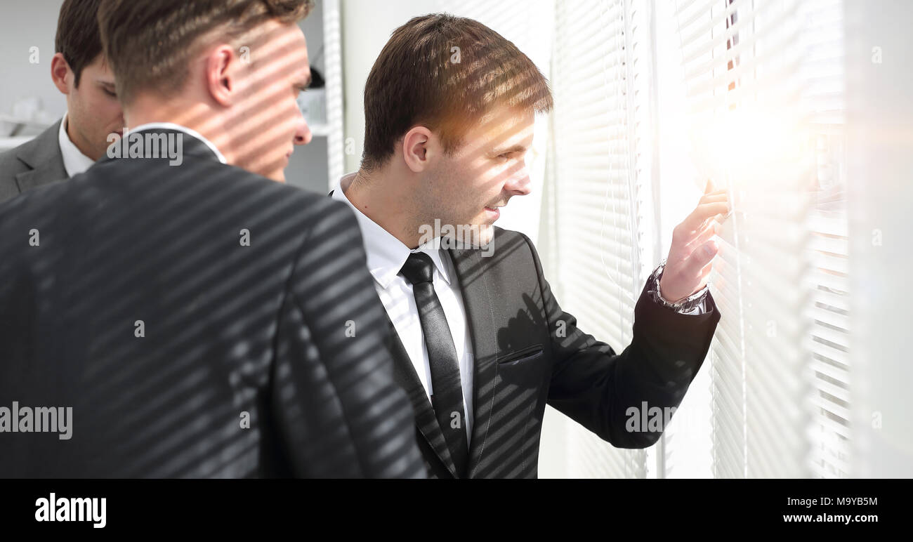 business people look in the window office Stock Photo - Alamy