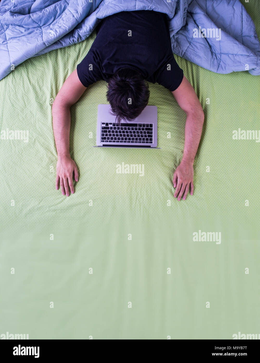 Fall asleep in the bed while using computer laptop Stock Photo - Alamy