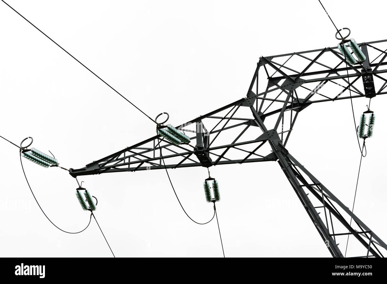 Close-up view of the crossarm and insulator strings of a high-voltage ...