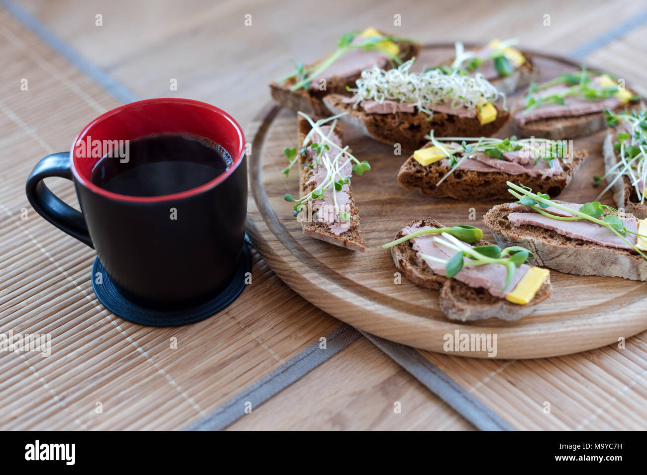 Wholegrain sandwiches with micro greens and morning coffee cup. Vegan ...