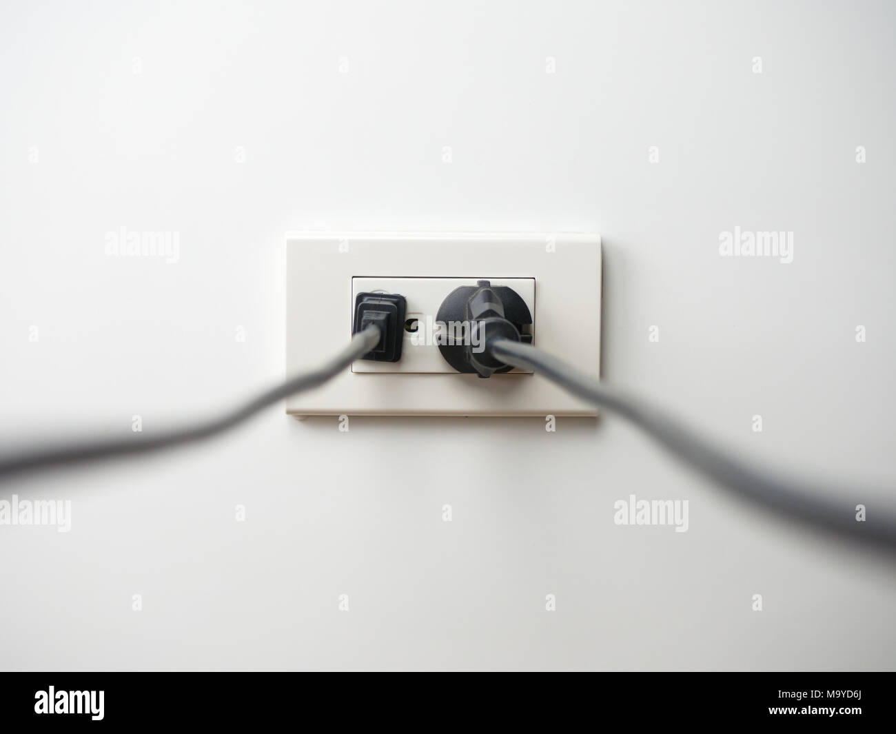 Extension Cord Plugged In Outlet High Resolution Stock Photography and ...