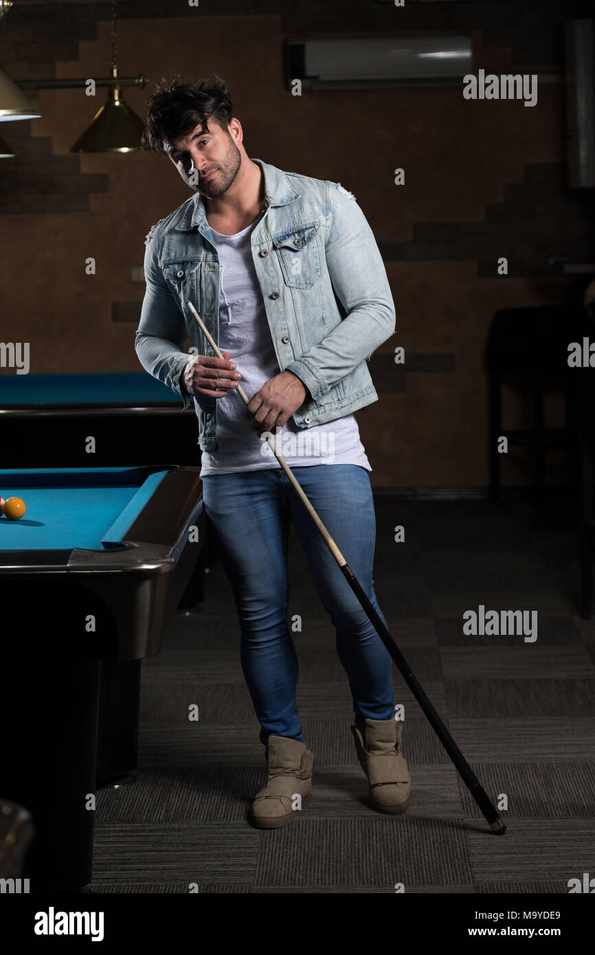 Portrait Of A Young Man Concentration On Ball In Pool Game Billiard ...