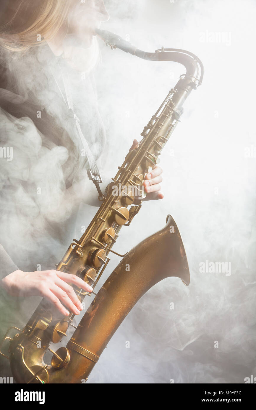 Girl playing sax hi-res stock photography and images - Alamy