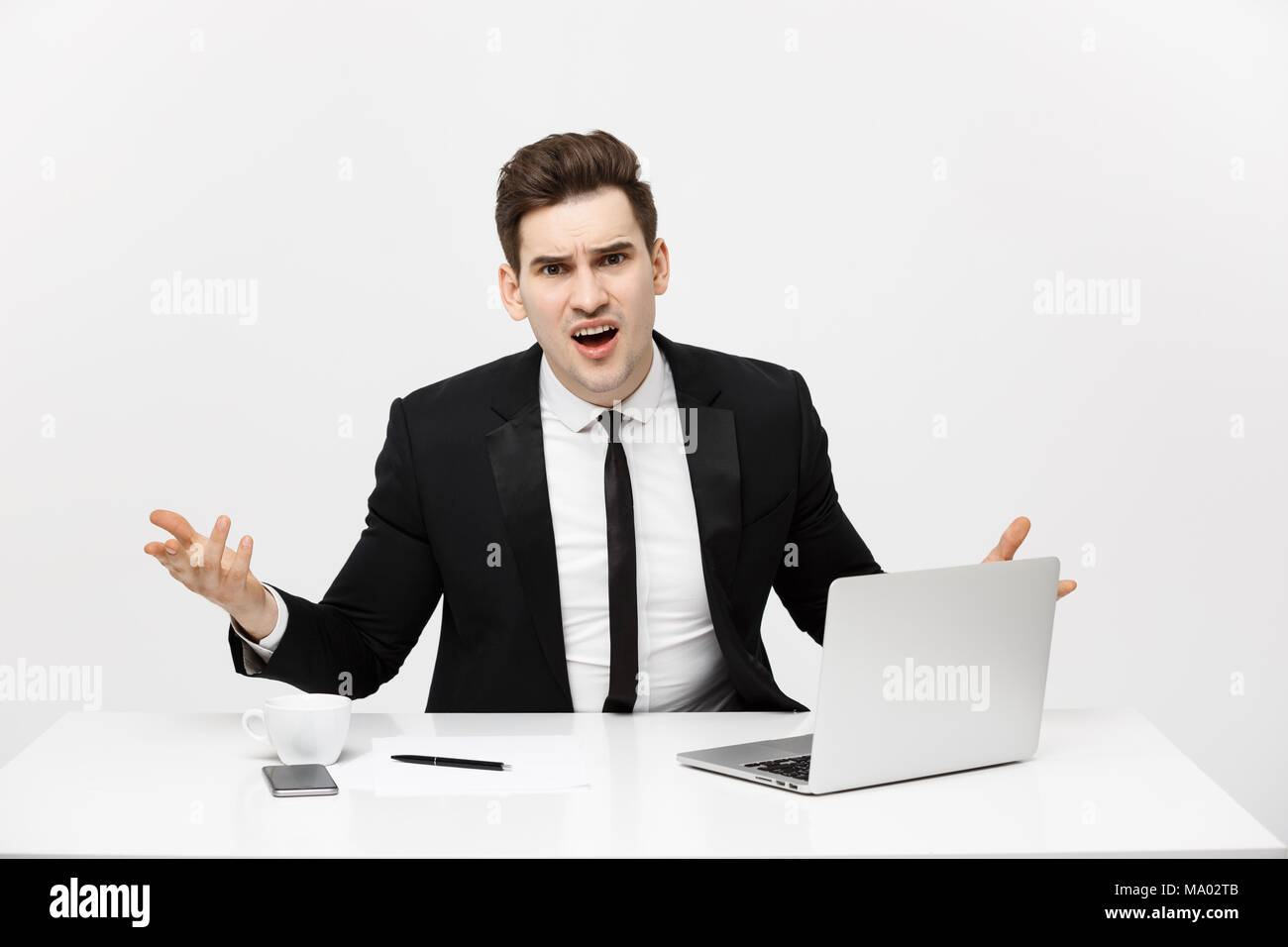 Business Concept: Portrait of screaming angry businessman sitting in ...