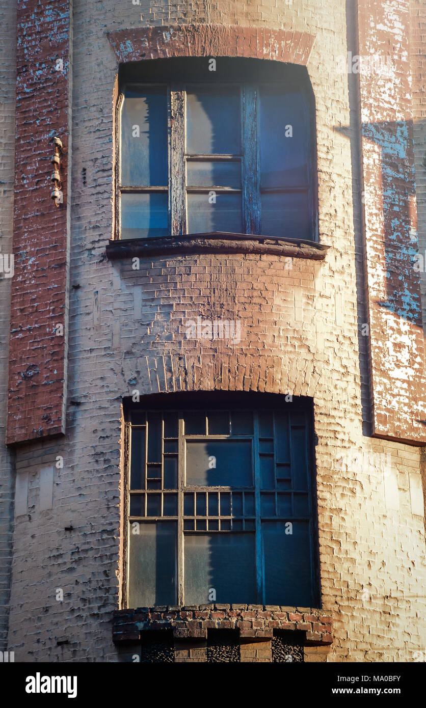 Two windows of old beautiful vintage house. Building exterior detail ...