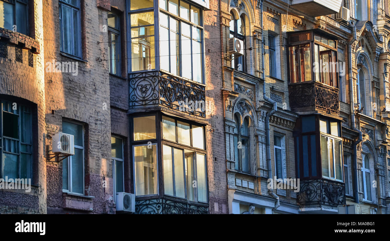 Facade of vintage apartment house. Building exterior with windows and ...