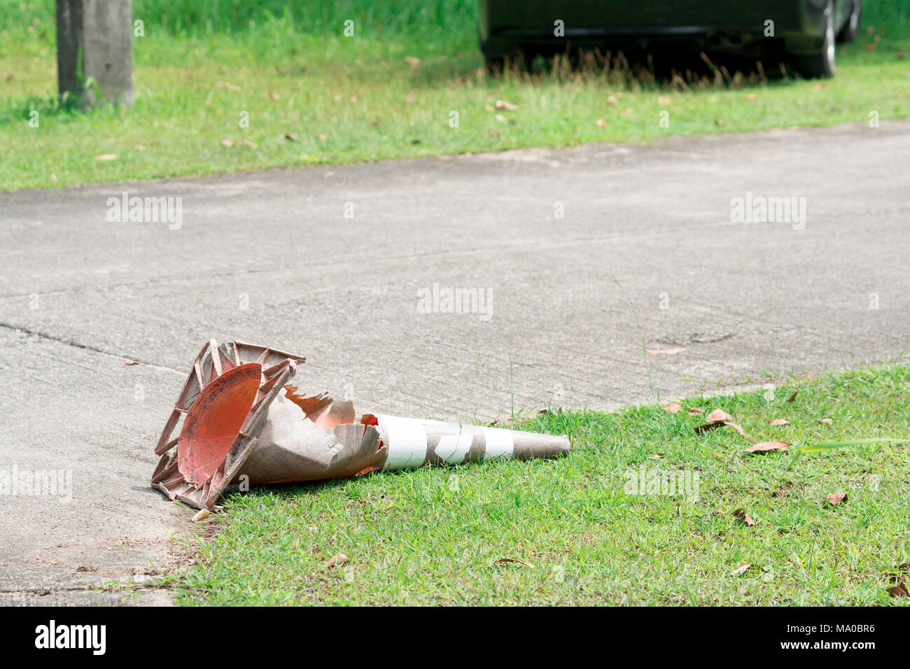 Orange traffic cones lying on the street Stock Photo - Alamy