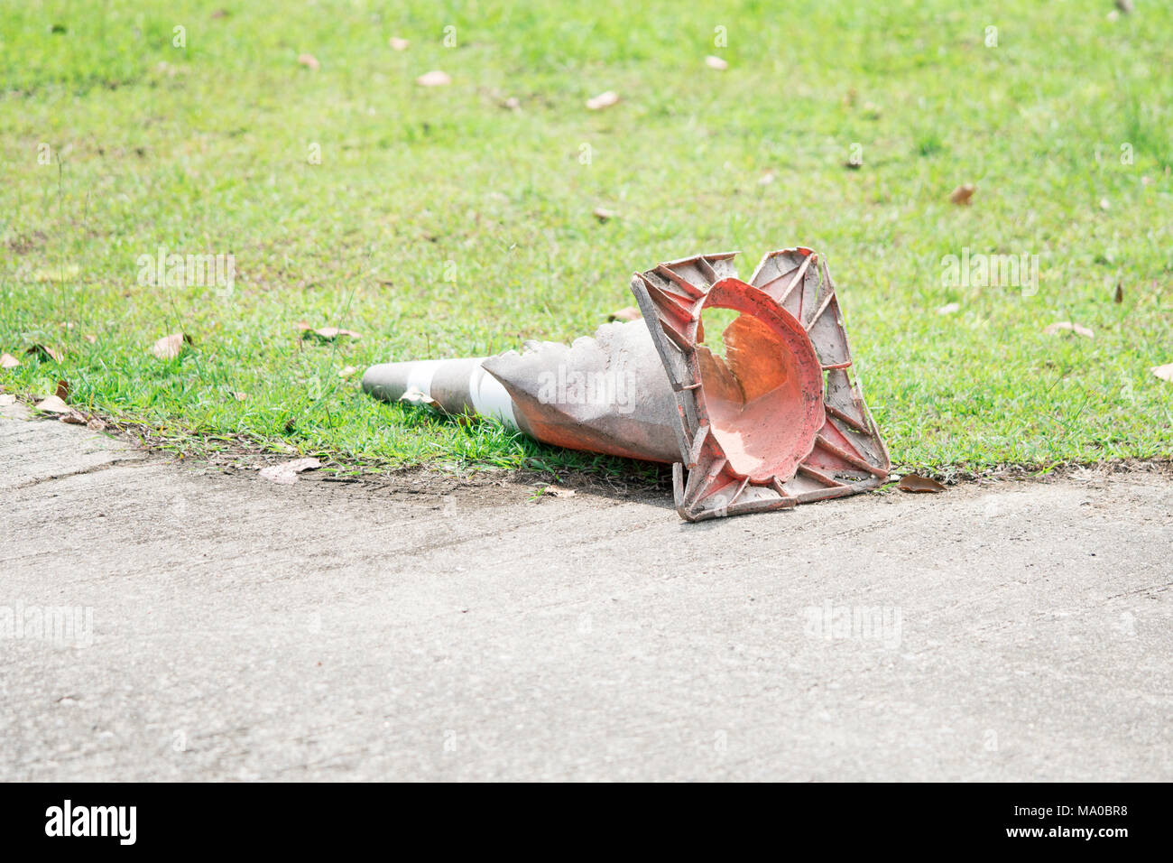 Orange traffic cones lying on the street Stock Photo - Alamy