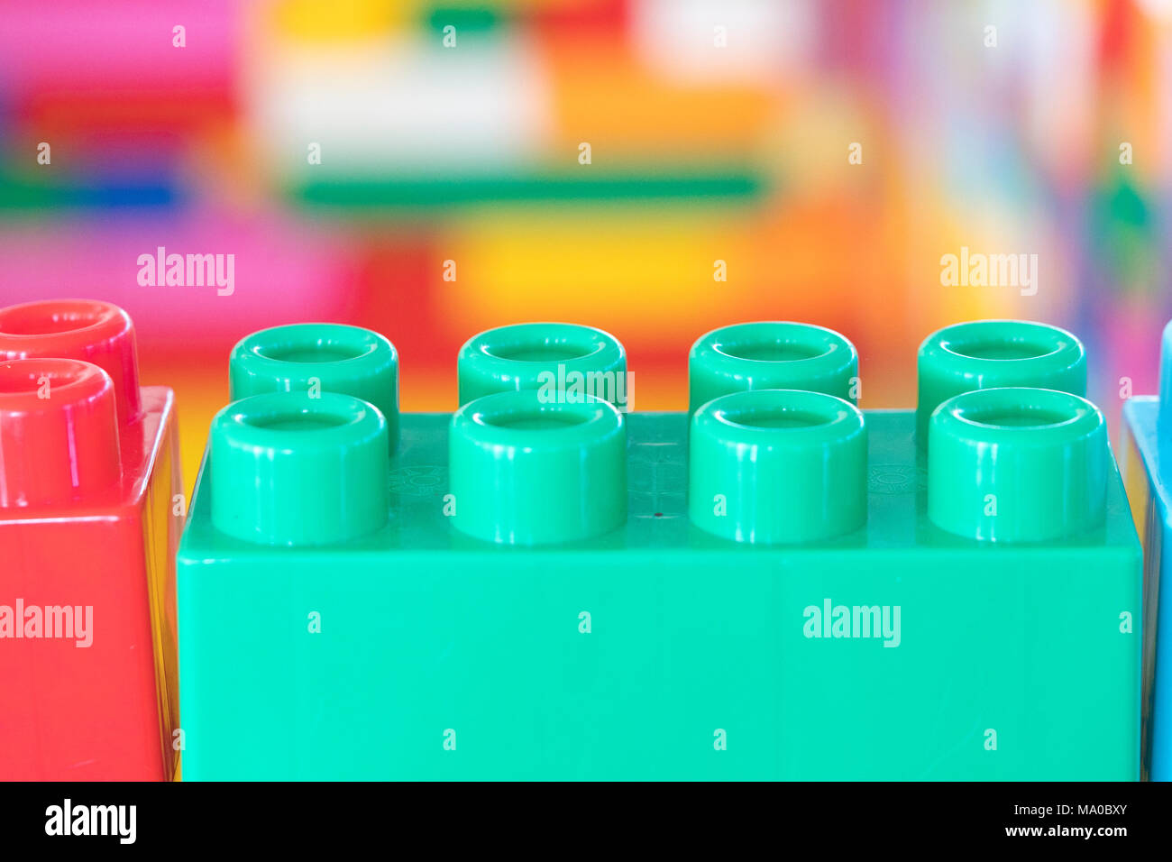 Colorful stacked toy plastic building blocks Stock Photo - Alamy