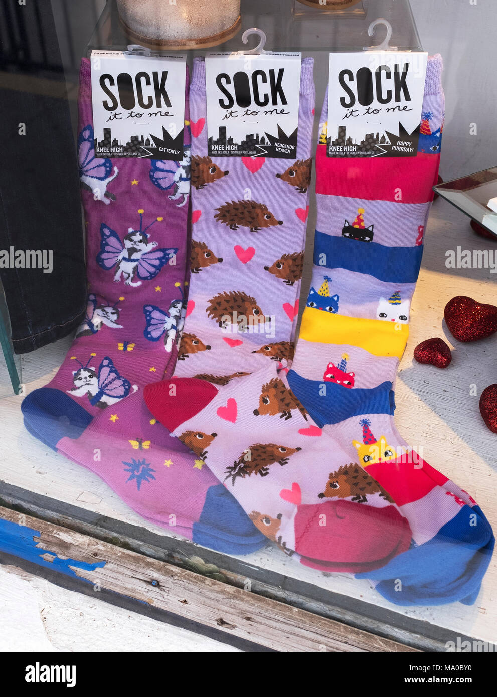 decorative socks in window display Stock Photo - Alamy