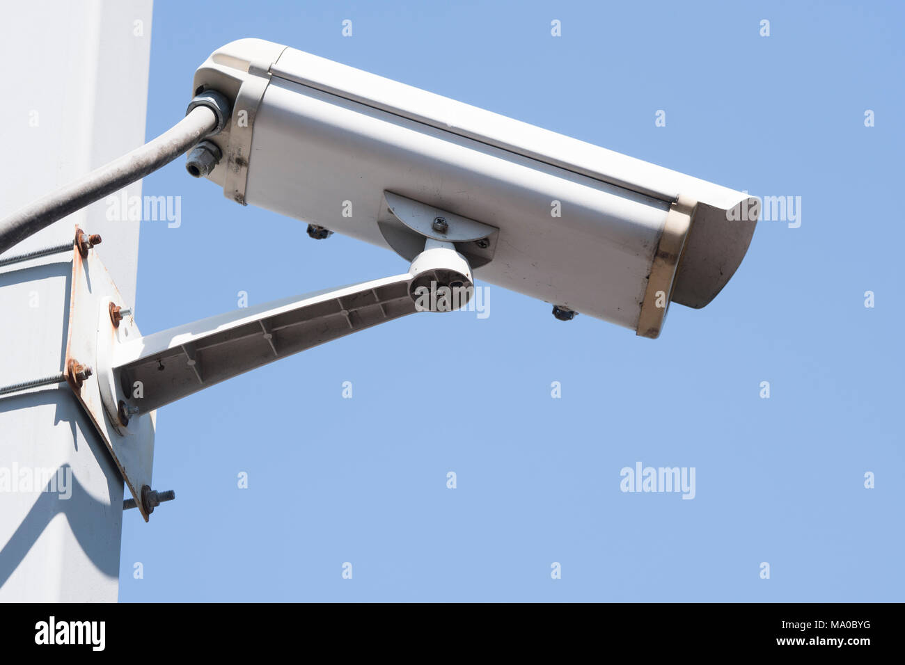 Security camera on blue sky background, property protection Stock Photo ...