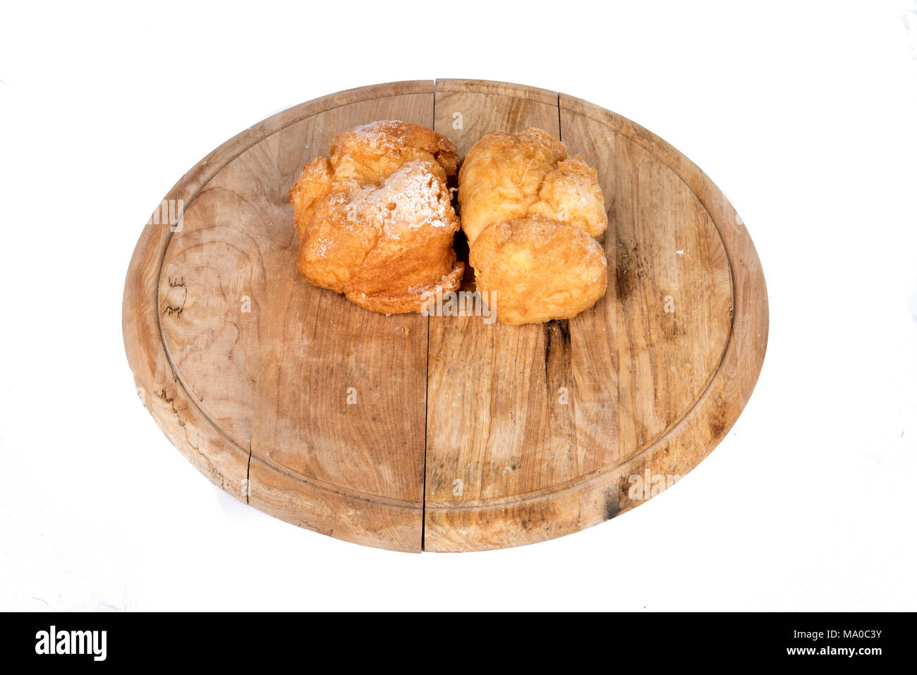 Fresh cream puffs on display on a wooden plate Stock Photo - Alamy
