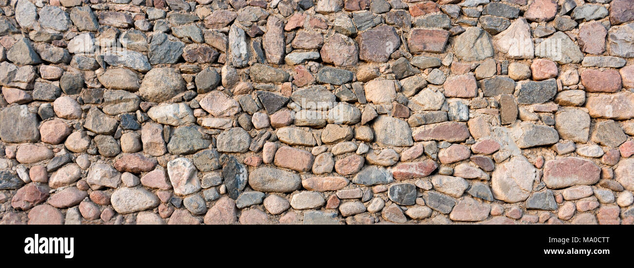 Stone wall rustic texture background. old granite wall Stock Photo - Alamy