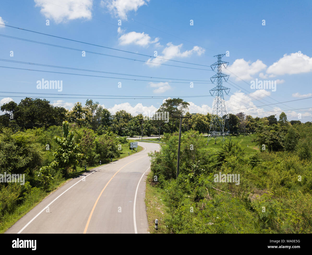 Aerial top view top view of the road through the trees Stock Photo - Alamy