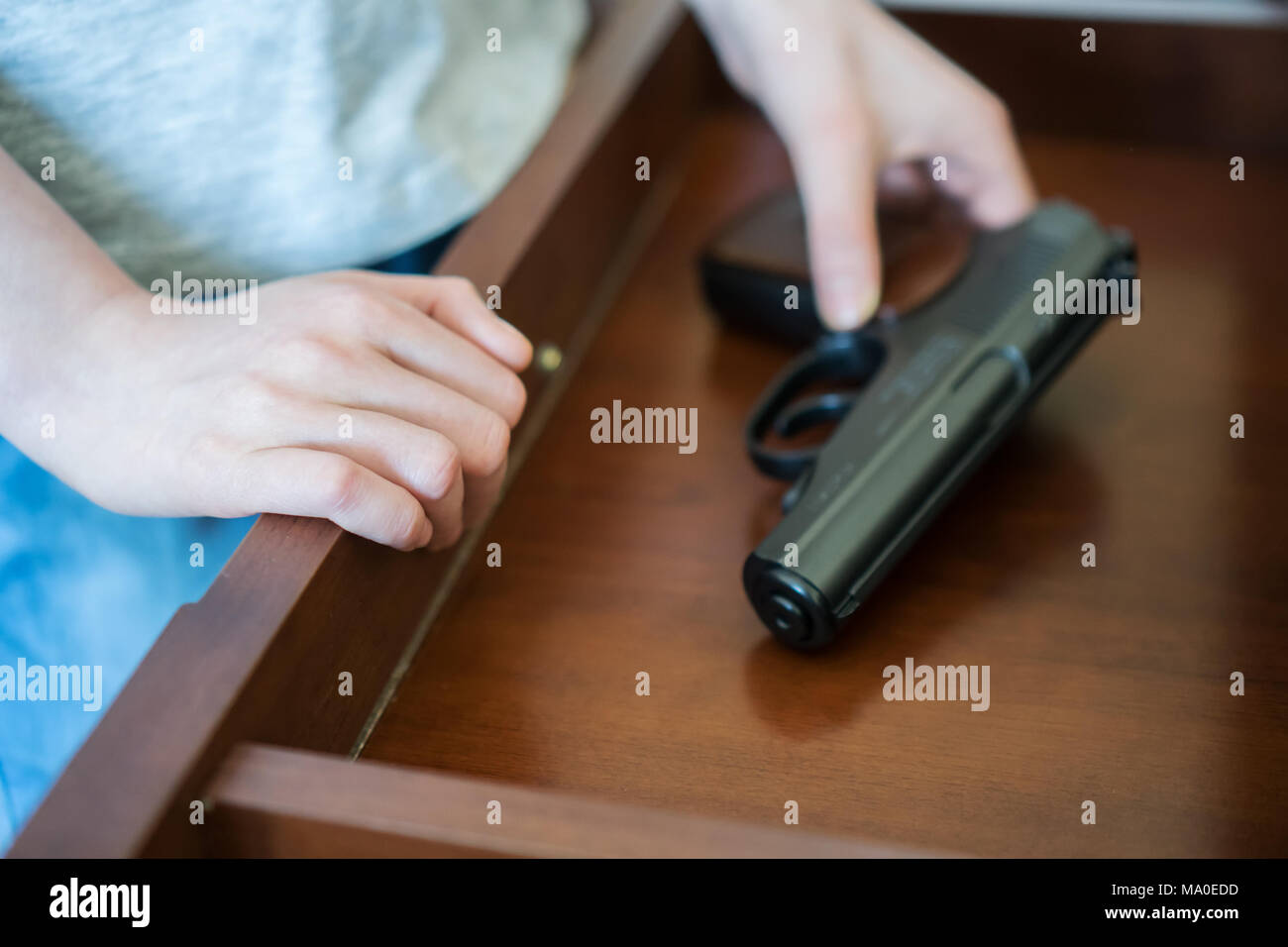 Hand gun drawer hi-res stock photography and images - Alamy