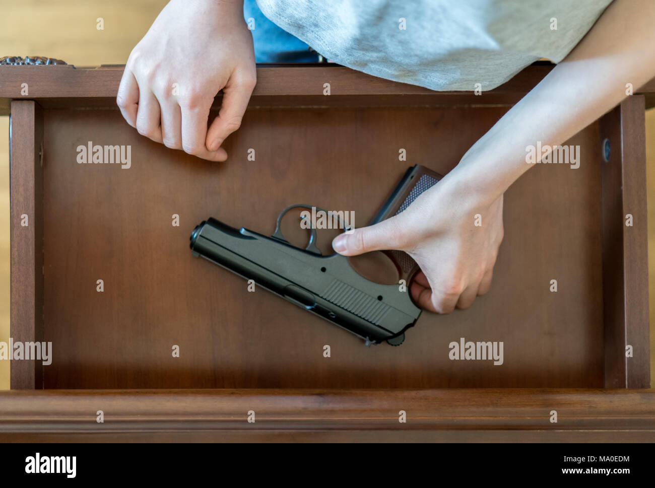 Hand gun drawer hi-res stock photography and images - Alamy