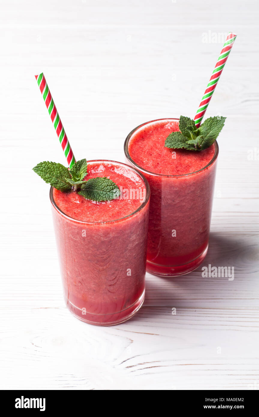 Strawberry smoothie or milkshake in glass on white background. Healthy ...