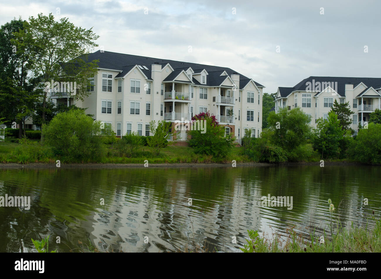 house building in front of lake Stock Photo - Alamy