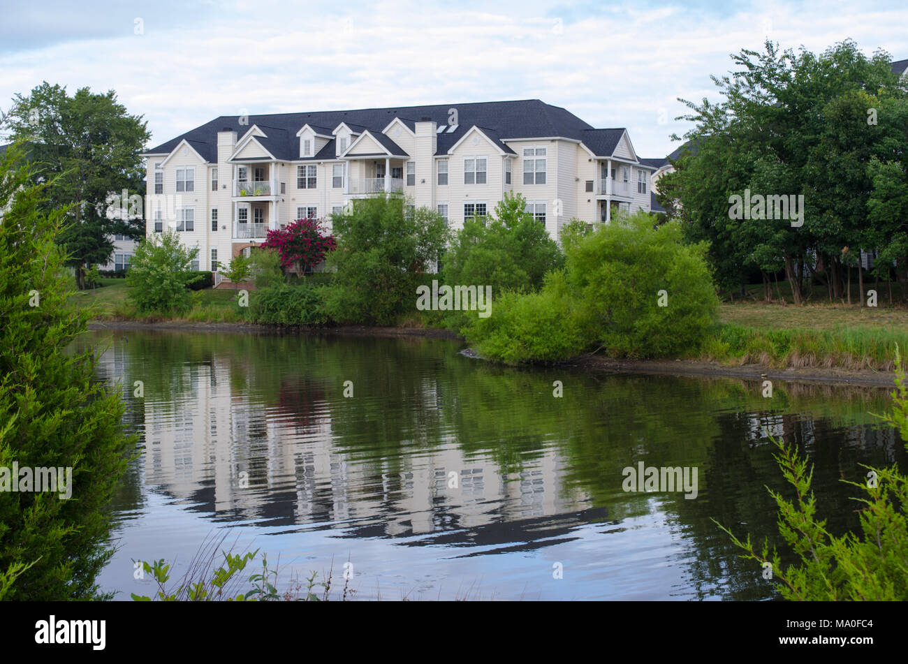 house building in front of lake Stock Photo - Alamy