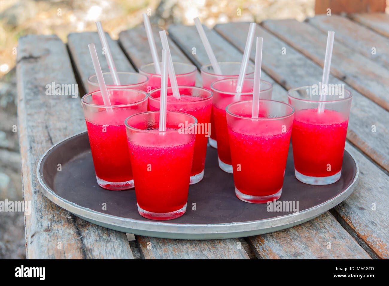 Strawberry juices in tray on Wooden pathway Stock Photo - Alamy