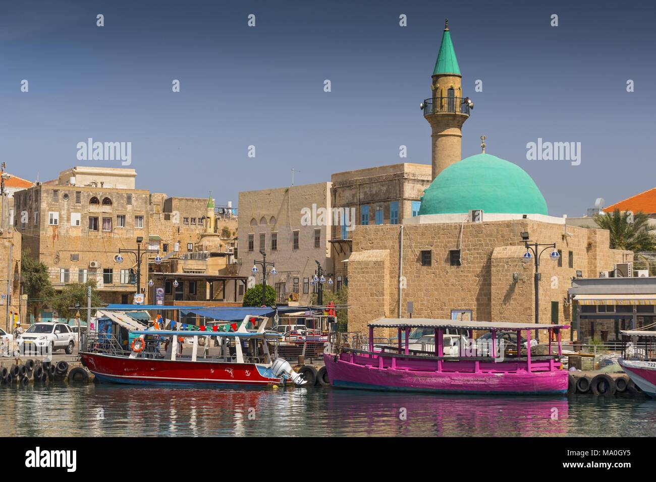 Port of Akko (Acre) with boats, mosque and the old city in the ...
