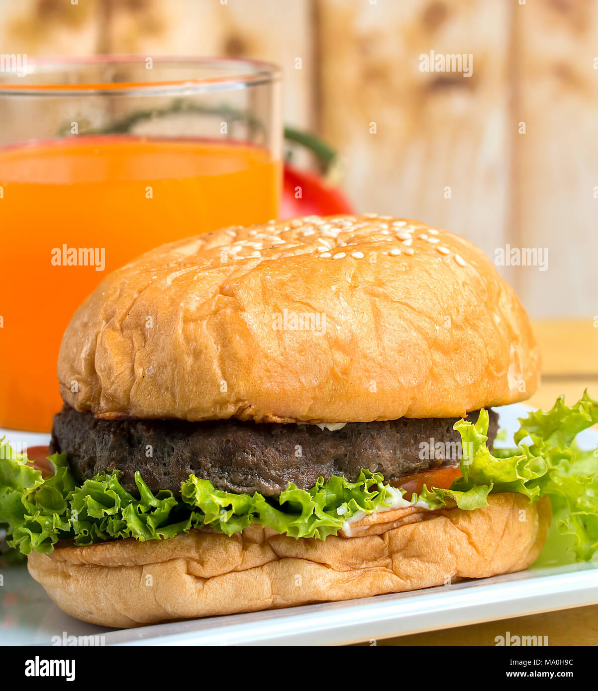 Burger Juice Lunch Showing Orange Drink And Fruit Stock Photo - Alamy