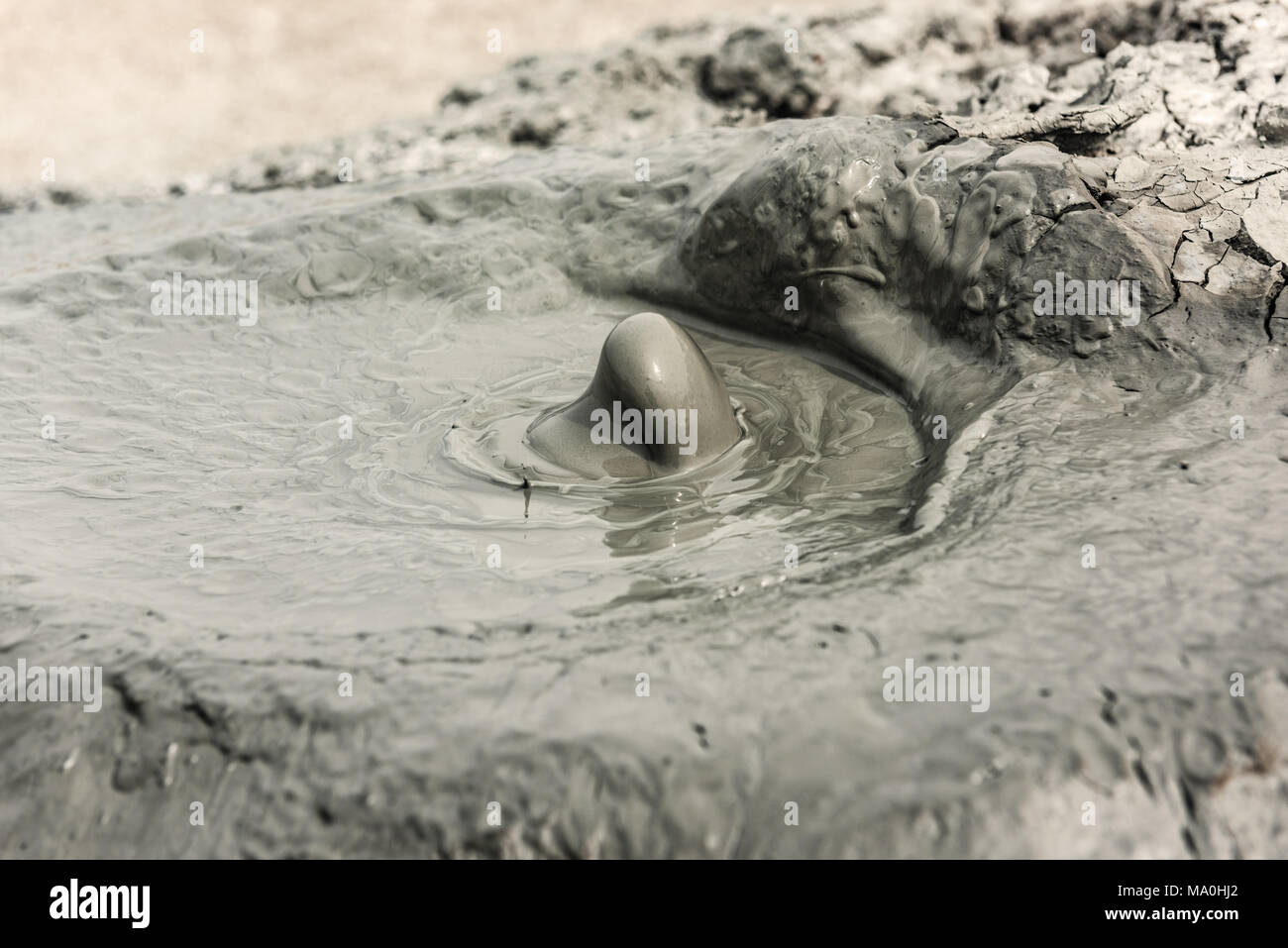 Mud volcano crater Stock Photo - Alamy