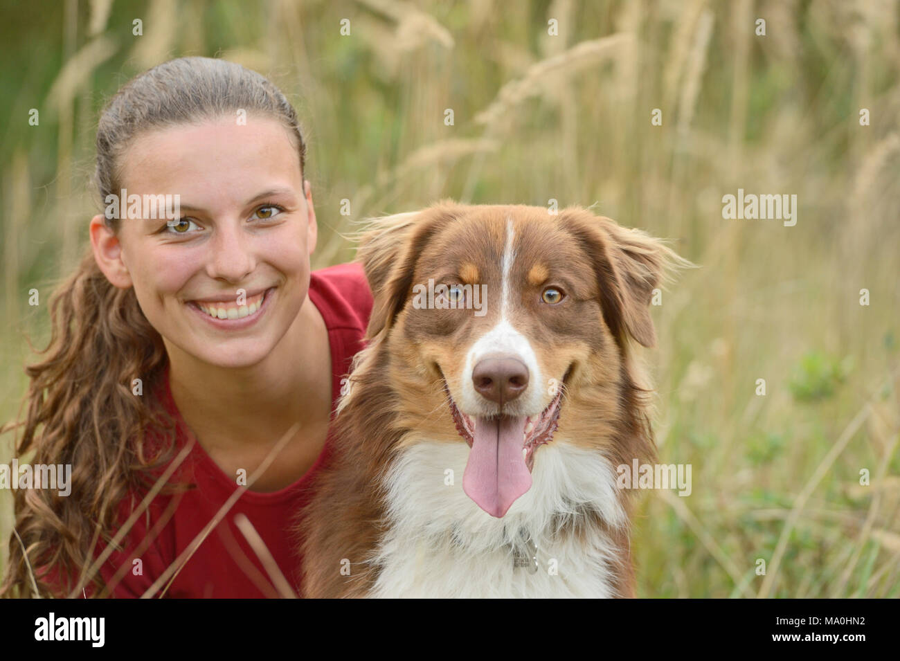 Woman young australian shepherd hi-res stock photography and images - Alamy