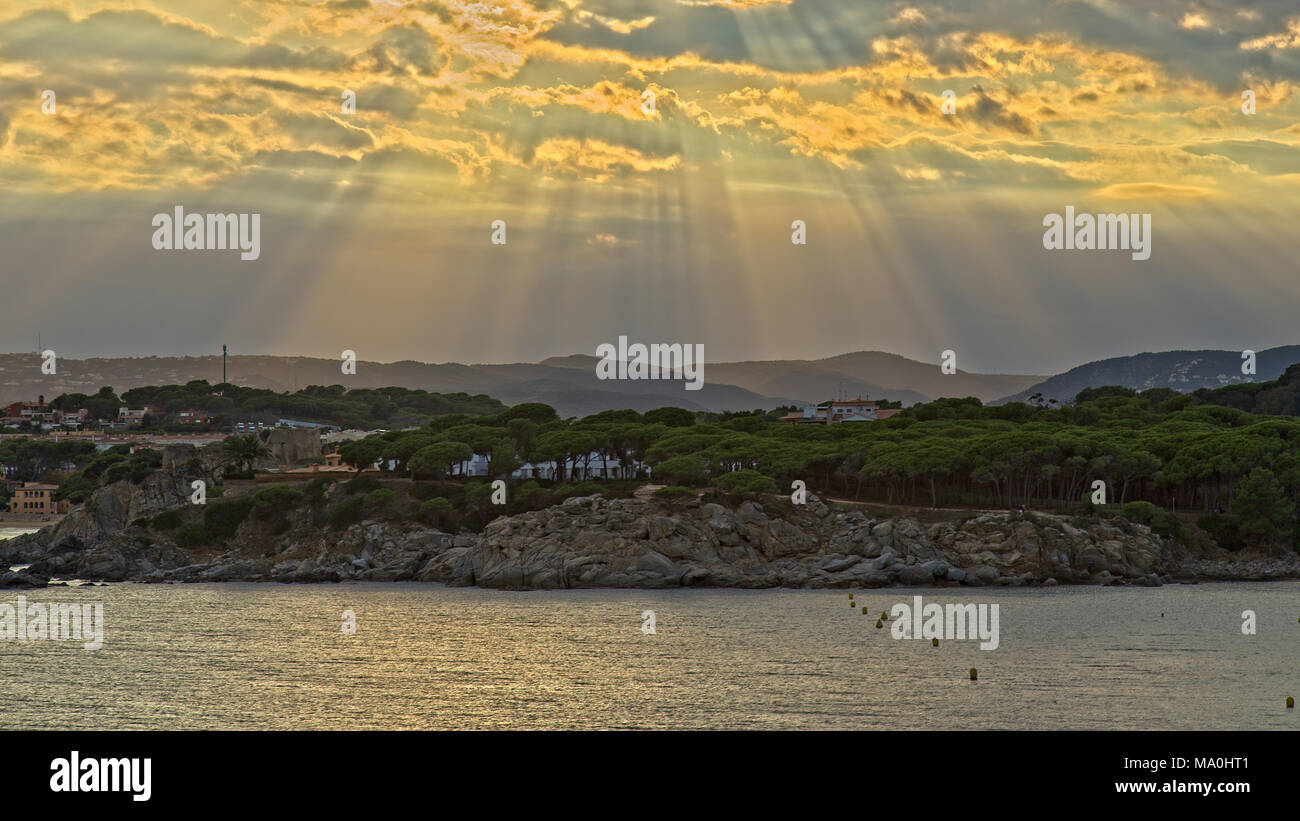 Nice sunbeams over the coastal in Costa Brava in Spain at the sunset ...