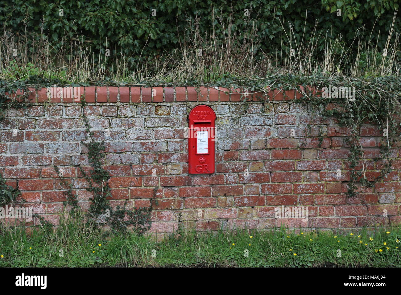 The Red Mailbox on the Wall Stock Photo - Alamy