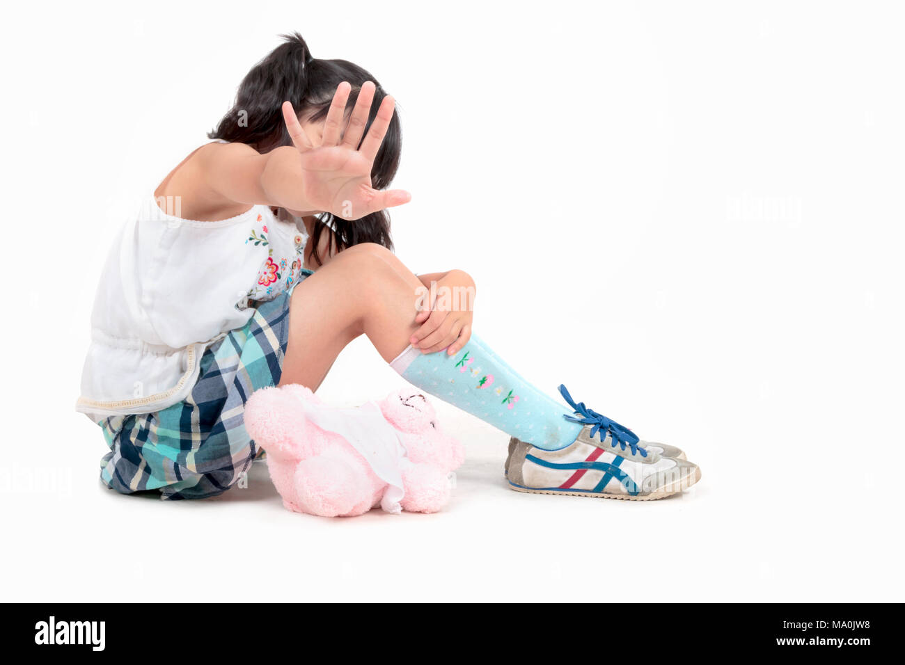 Scared little Asian girl making stop gesture with her hand Stock Photo ... Scared little Asian girl making stop gesture with her hand Stock Photo ...