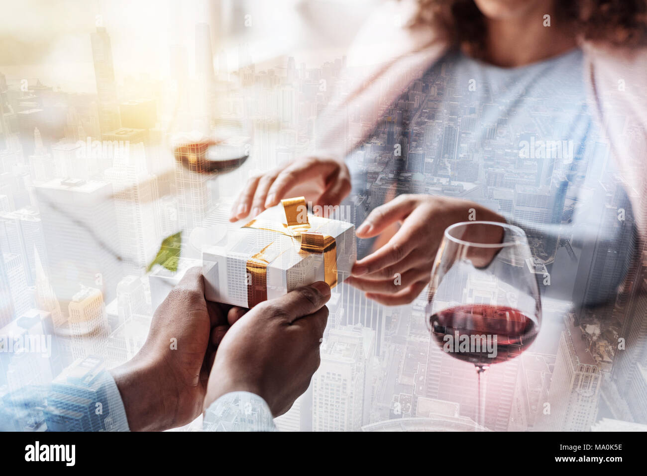 Young man making present for his woman Stock Photo - Alamy