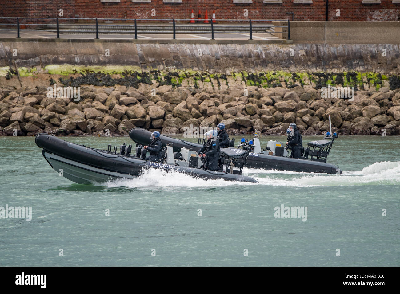 Officers from the Ministry of Defence Police Marine Unit on patrol in ...