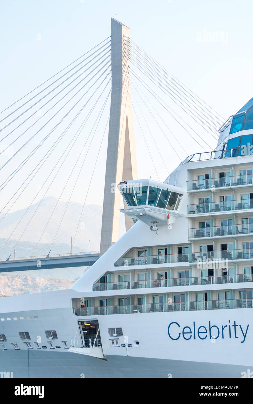 The cruise ship Celebrity passes by the single tower suspension bridge ...