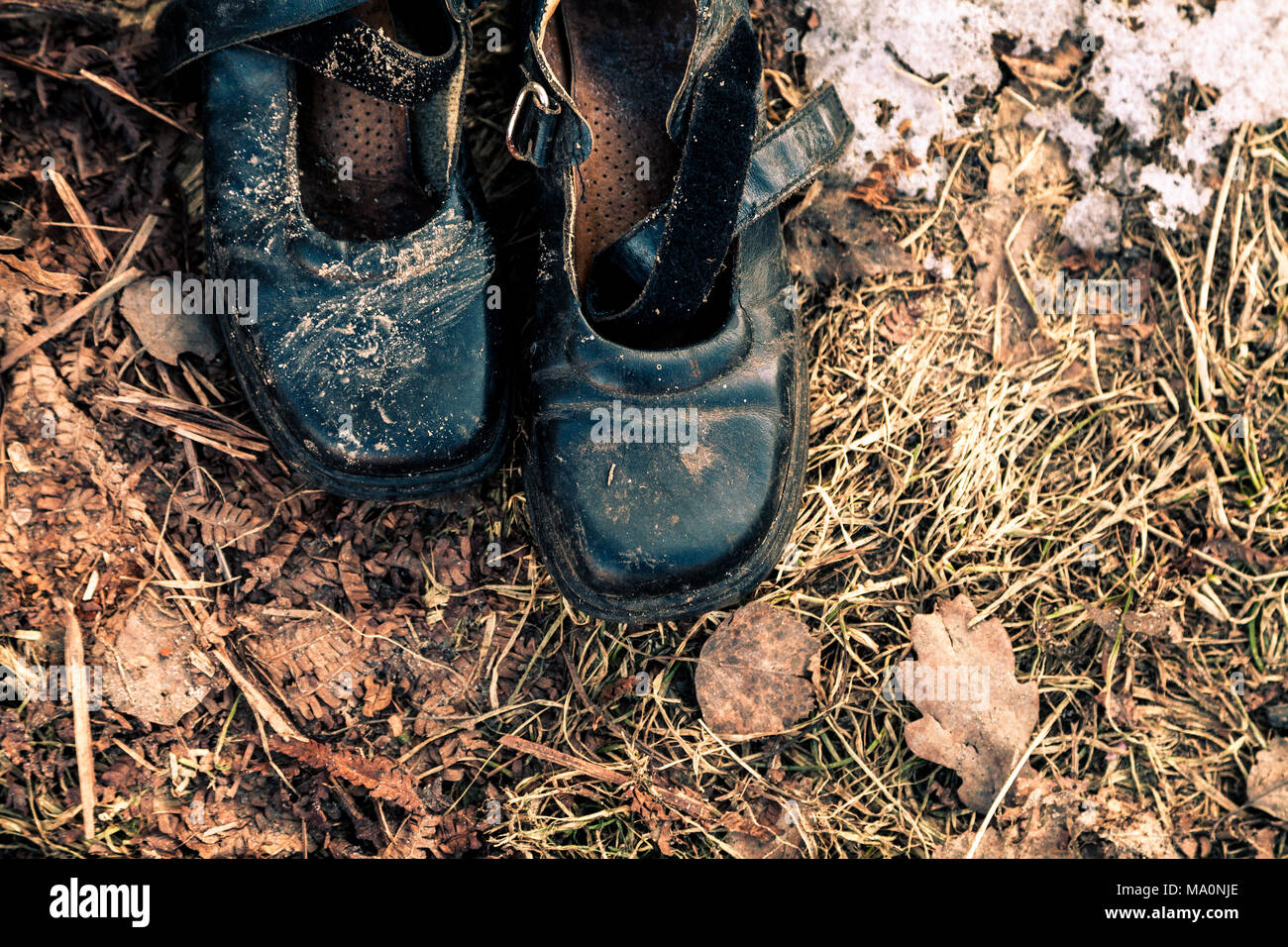 Old burnt shoes on the burnt grass Stock Photo - Alamy