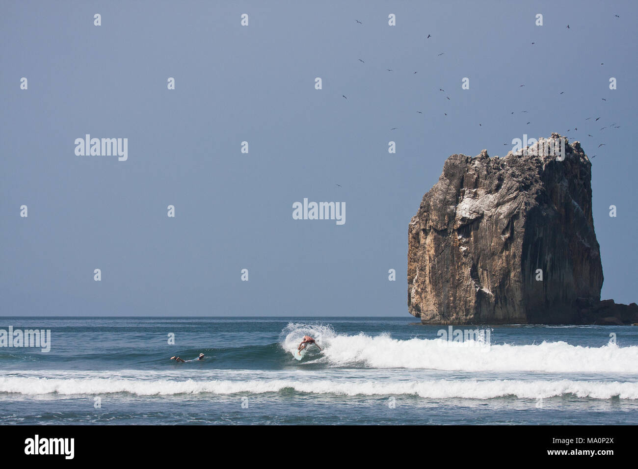 A surfer having some fun at witches rock in costa rica Stock Photo - Alamy
