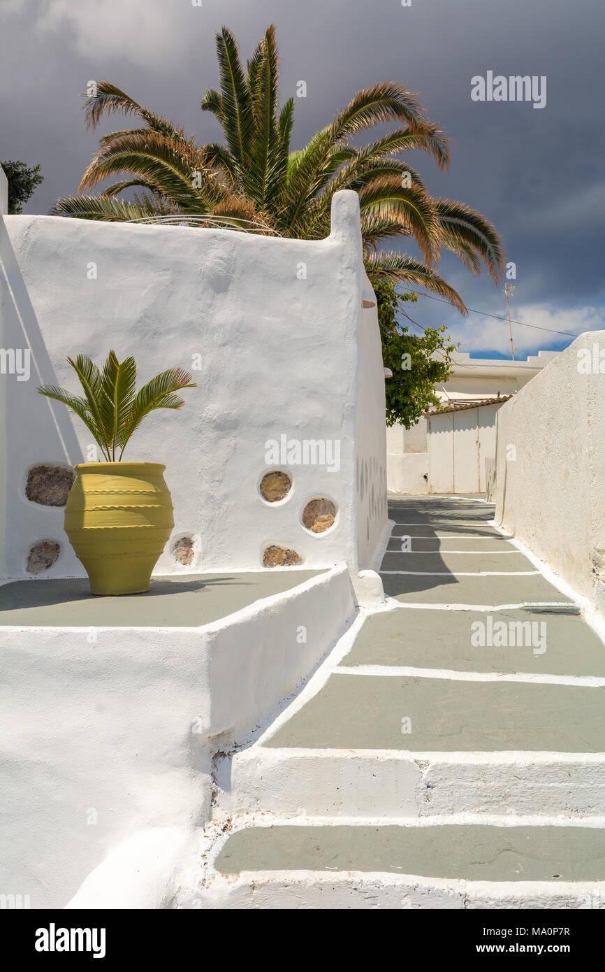 MILOS, GREECE - May 18, 2017: White wall and walkway in Pollonia ...