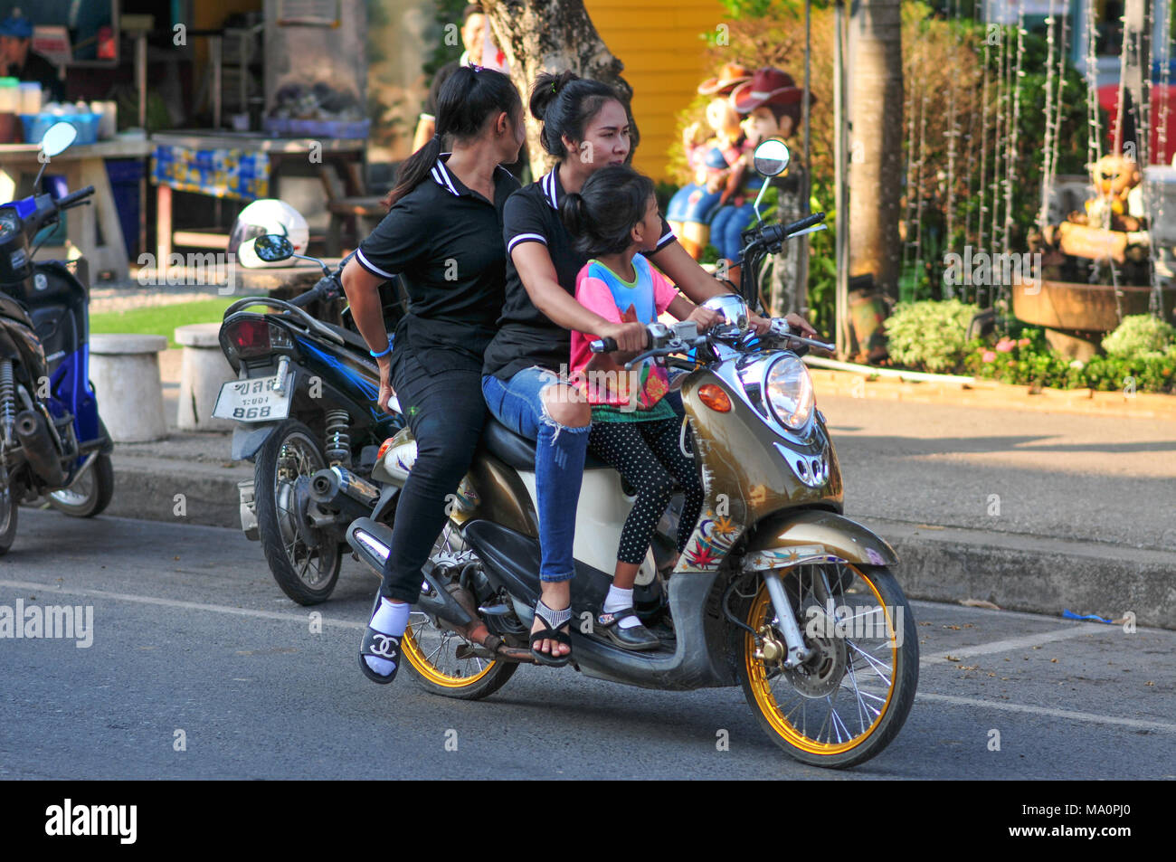 Motorbike riders in Thailand Stock Photo - Alamy