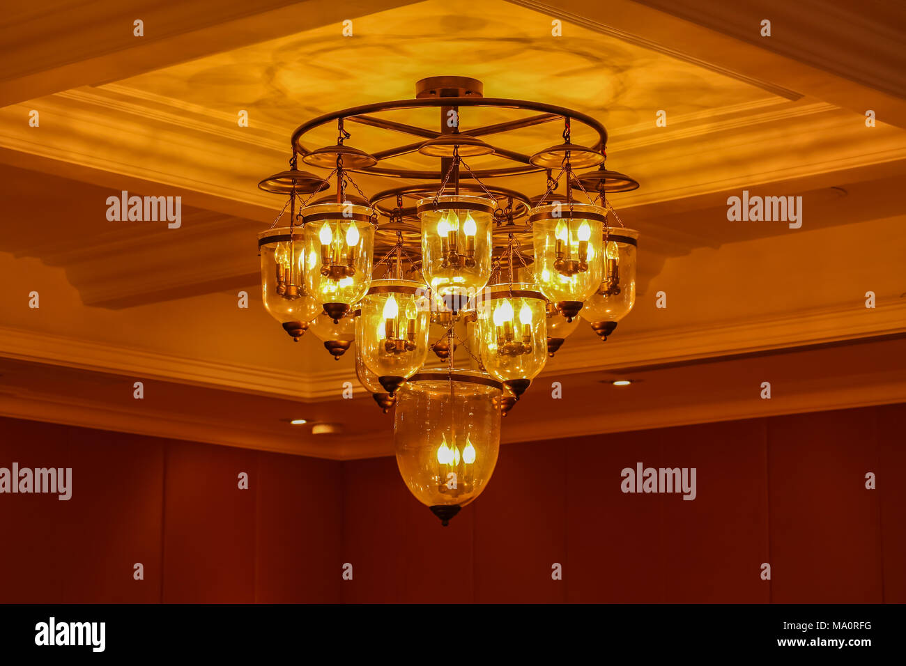 Yellow lamps with glass structure on ceiling in ballroom Stock Photo ...
