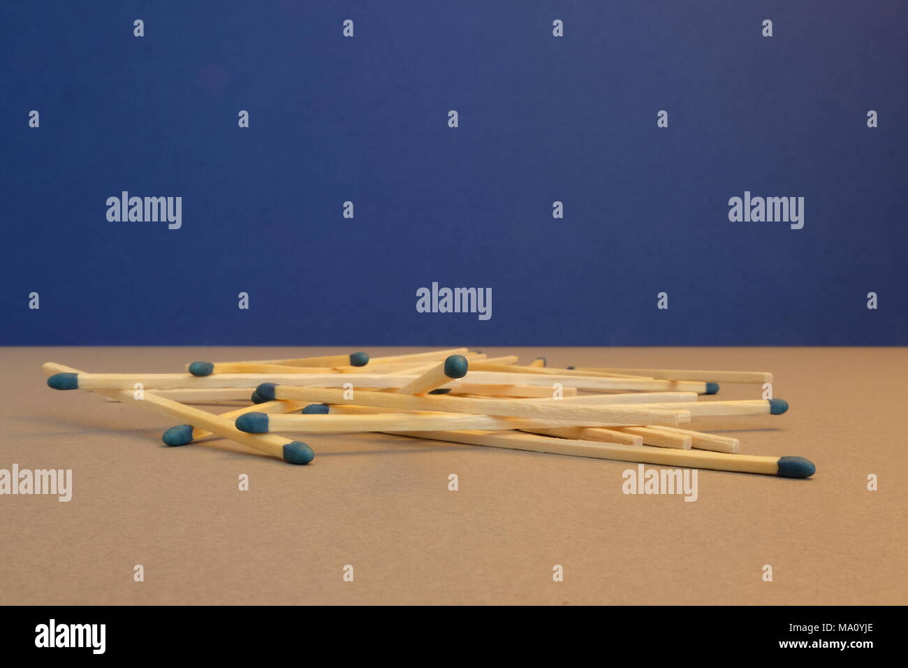 Blue head matchsticks in random pile with blue background Stock Photo ...