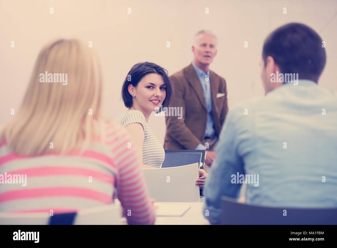 group of students study with professor in modern school classroom Stock ...
