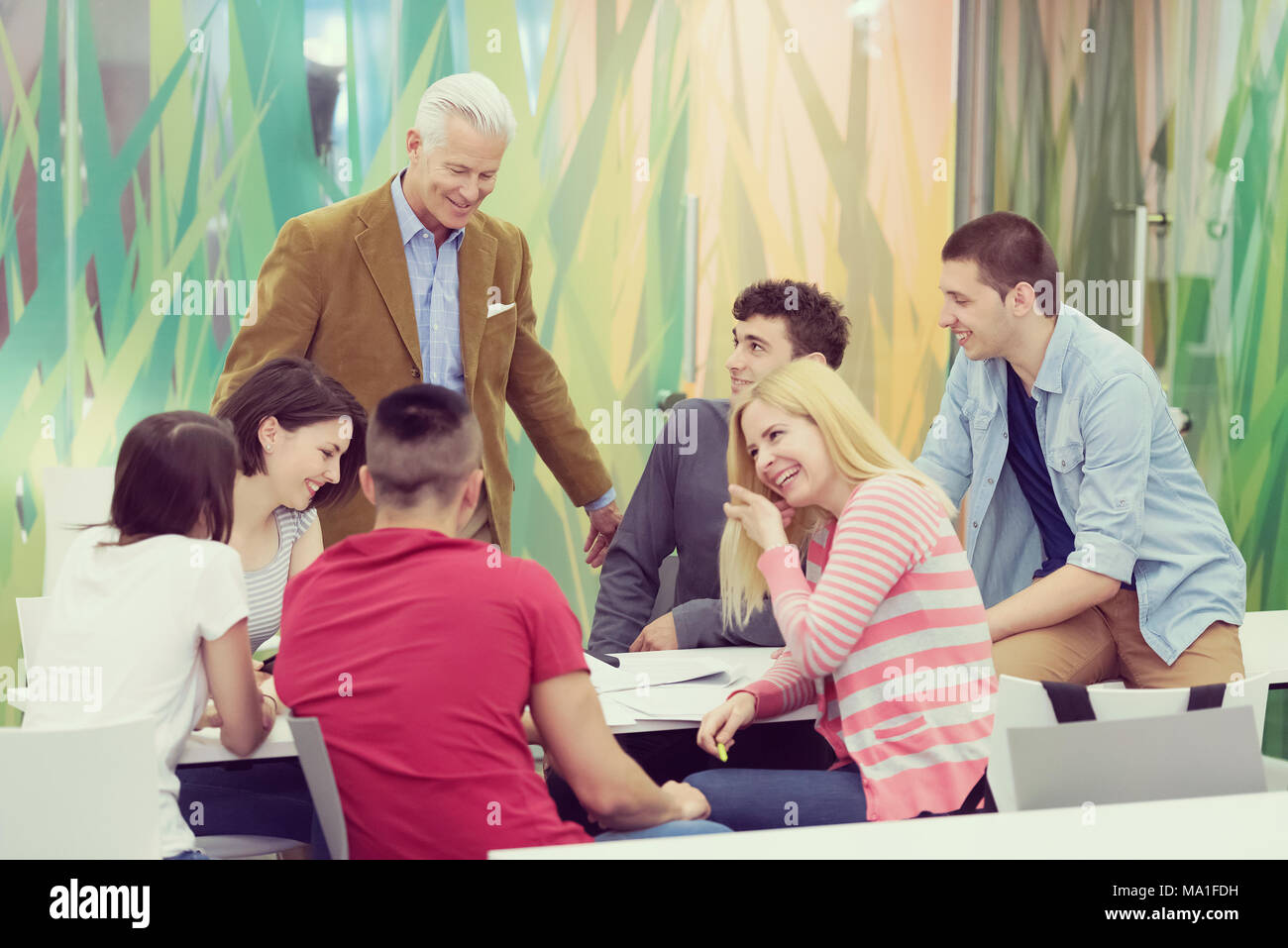 group of students study with professor in modern school classroom Stock ...