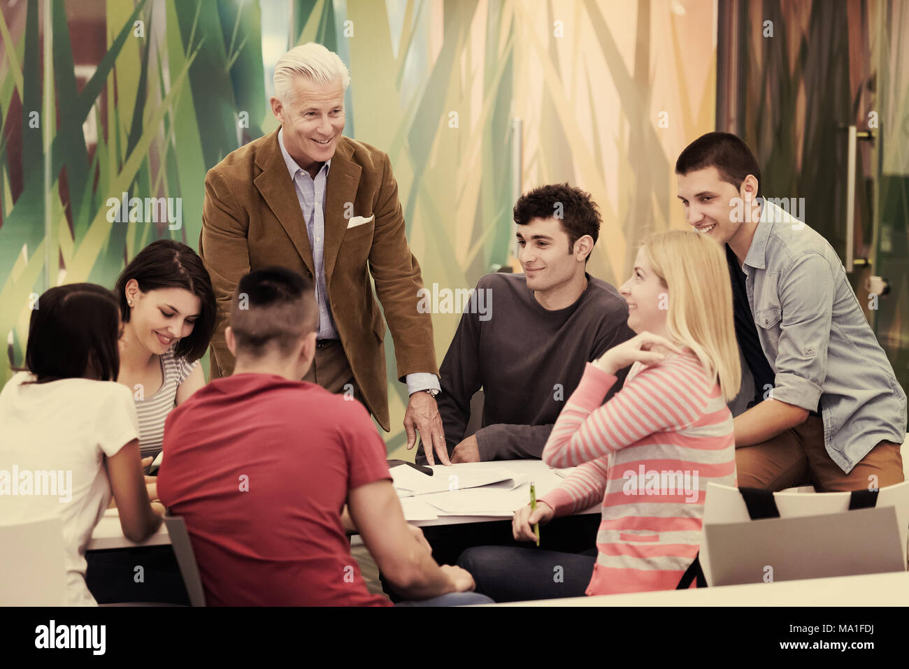 group of students study with professor in modern school classroom Stock ...